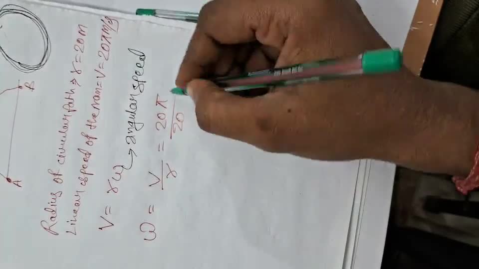 A boy is running around in circles around a track of radius 20 m. He star..